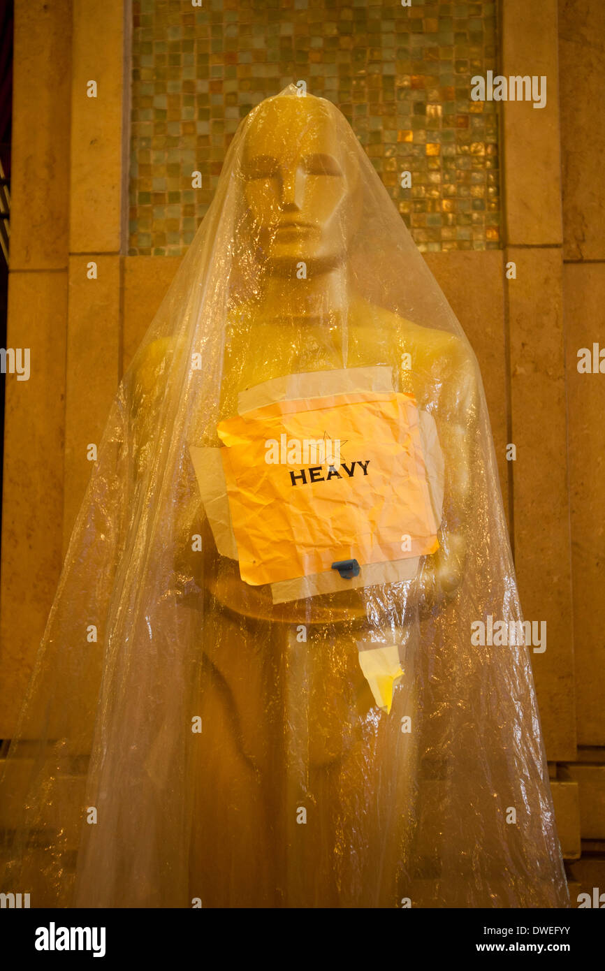 Oscar statue near Kodak Theater, protected with plastic from the rain ...