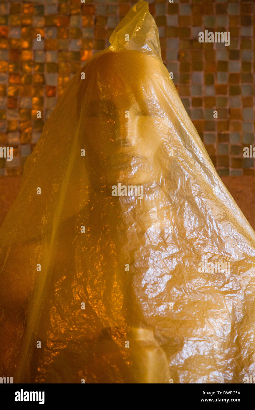 Oscar statue near Kodak Theater, protected with plastic from the rain ...