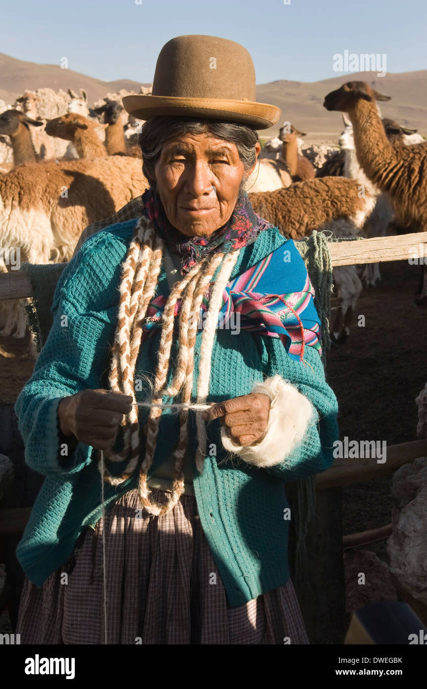 Woman spinning wool Stock Photo - Alamy