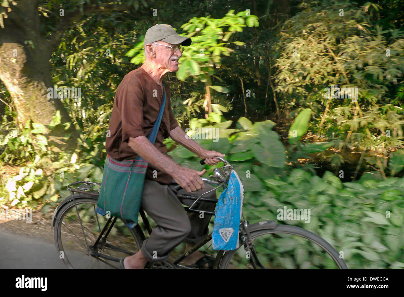 BANGLADESH American Catholic missionary priest riding a bicycle Stock ...