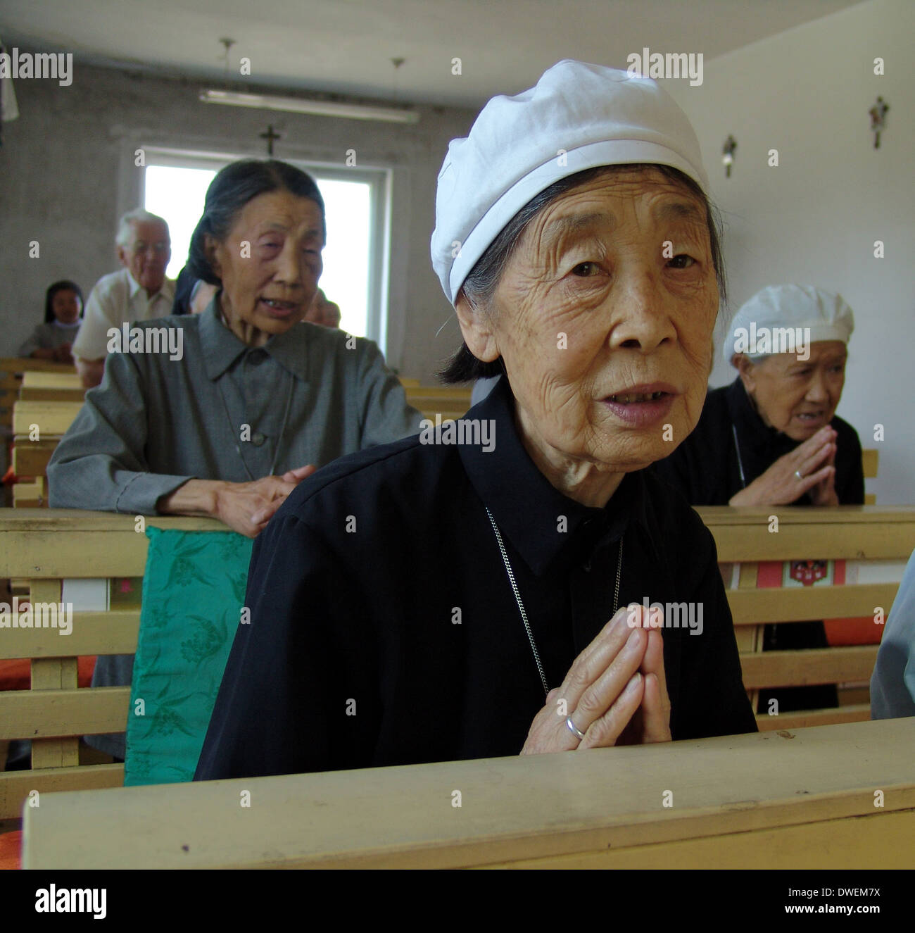 CHINA Elderly Chinese Catholic sister praying, Jilin Stock Photo - Alamy