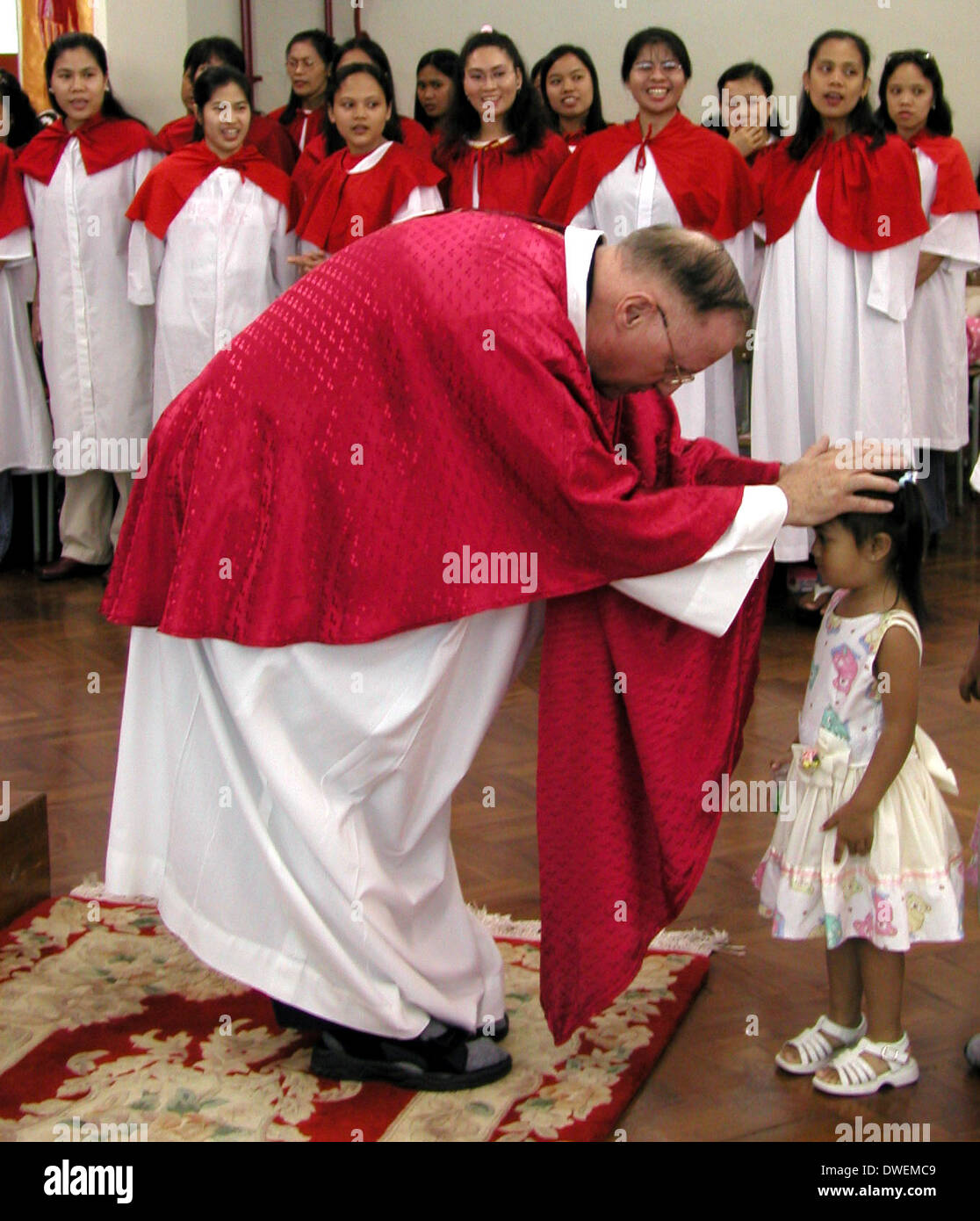 Hong Kong American missionary priest blessing a child Stock Photo - Alamy
