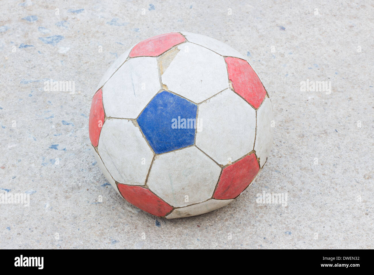countryside children play soccer ball on concrete field Stock Photo - Alamy