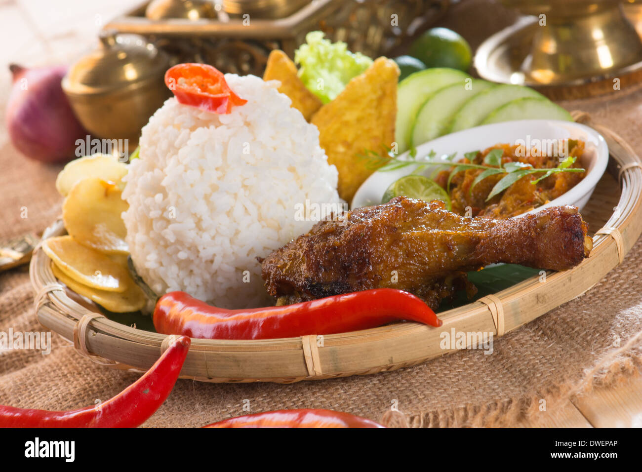 indonesian fried chicken rice on traditional background Stock Photo - Alamy