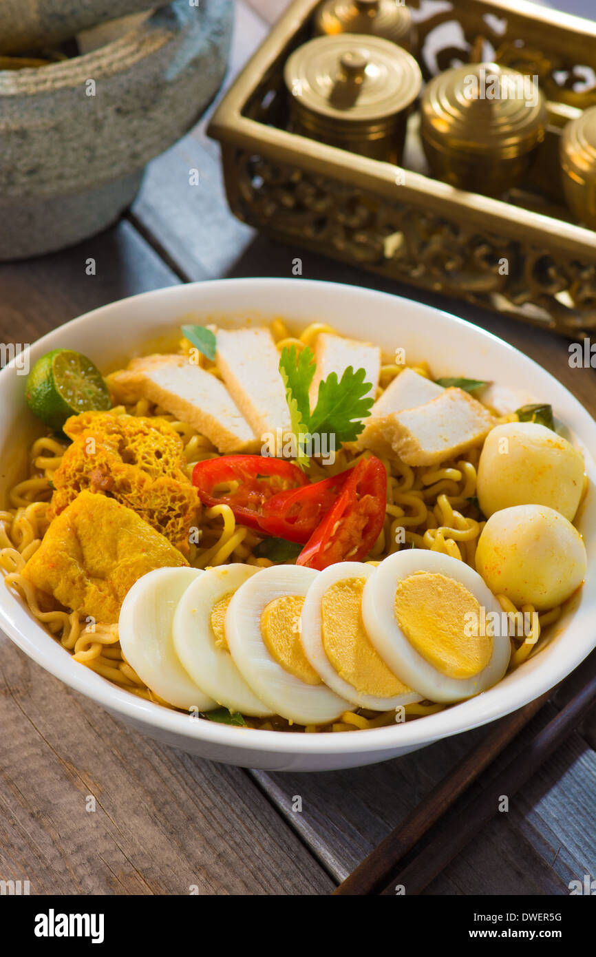 Hot and spicy Singapore Curry Noodle with decoration setup Stock Photo ...