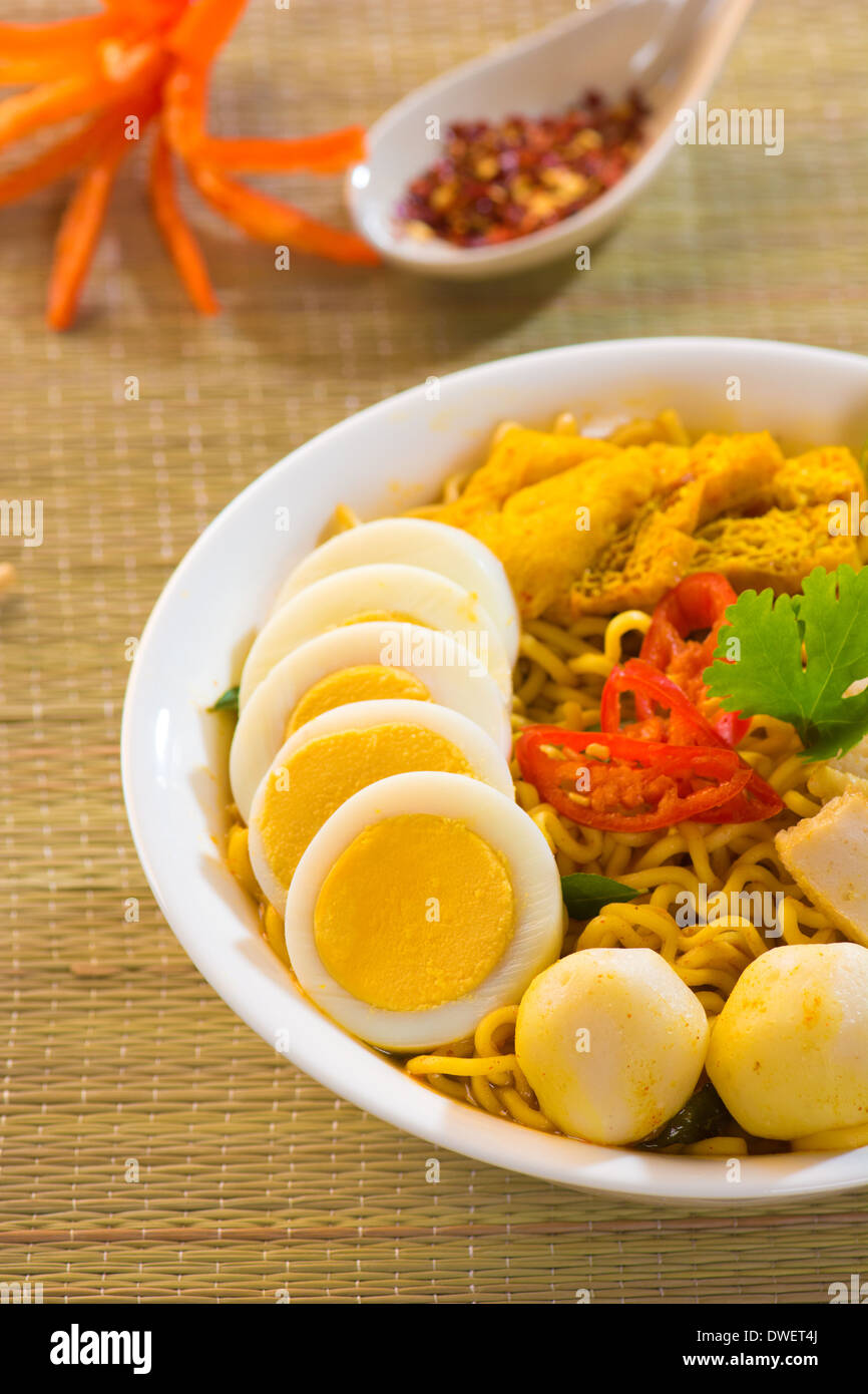 Hot and spicy Singapore Curry Noodle with decoration setup Stock Photo ...
