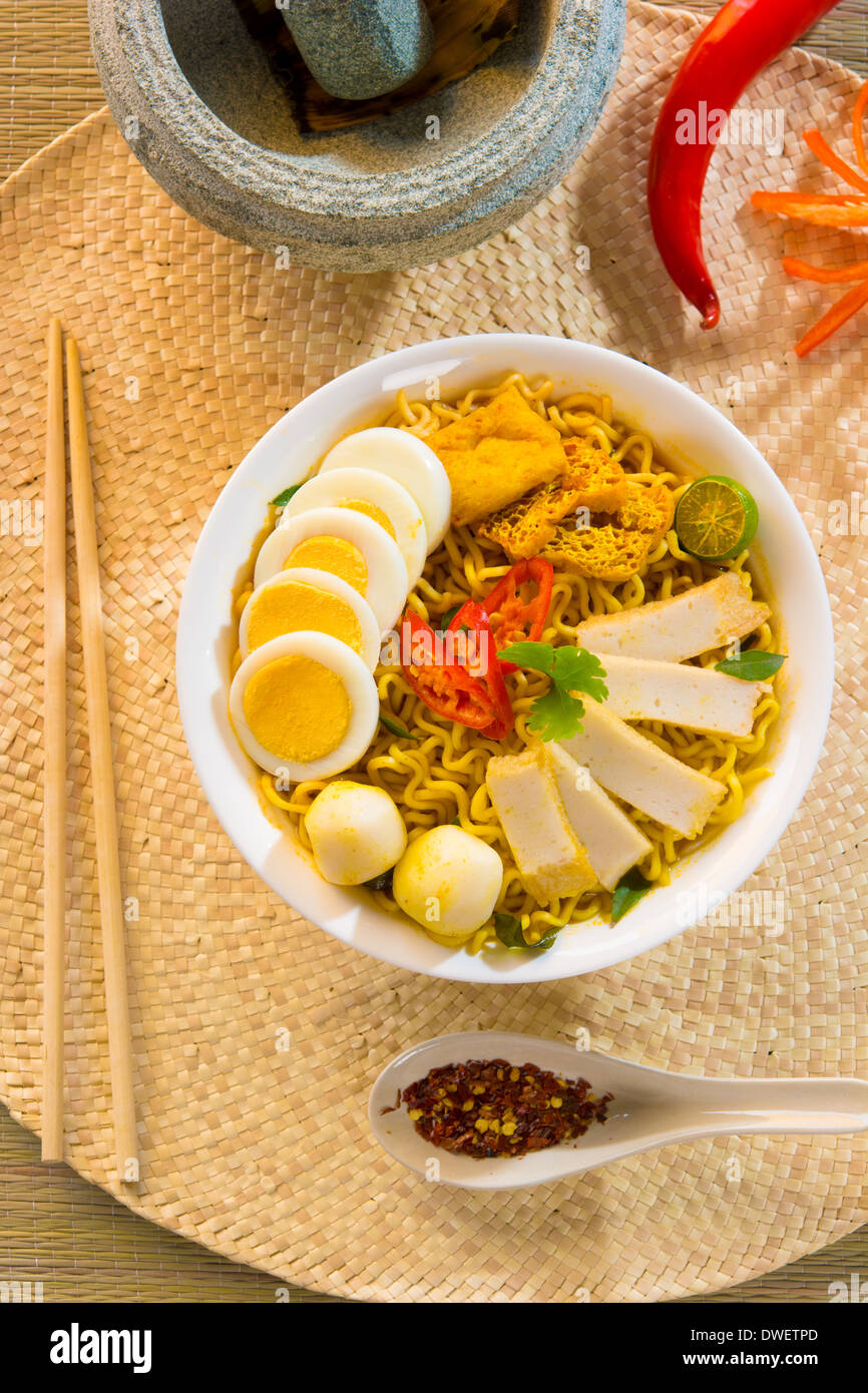 Hot and spicy Singapore Curry Noodle with decoration setup Stock Photo ...