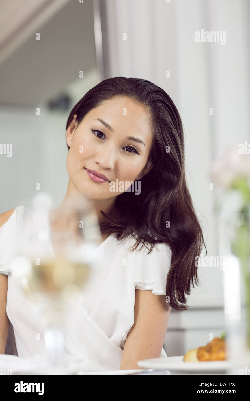 Beautiful smiling woman at meal table Stock Photo - Alamy