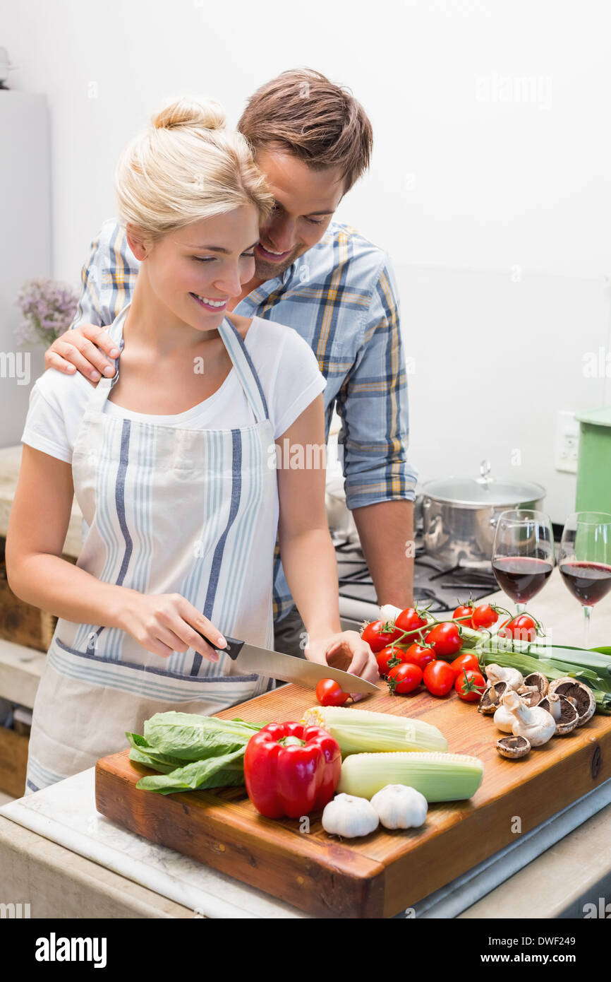 Couple preparing food together in the kitchen Stock Photo - Alamy