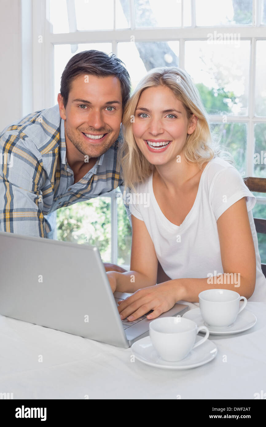 Happy young couple laptop hi-res stock photography and images - Alamy