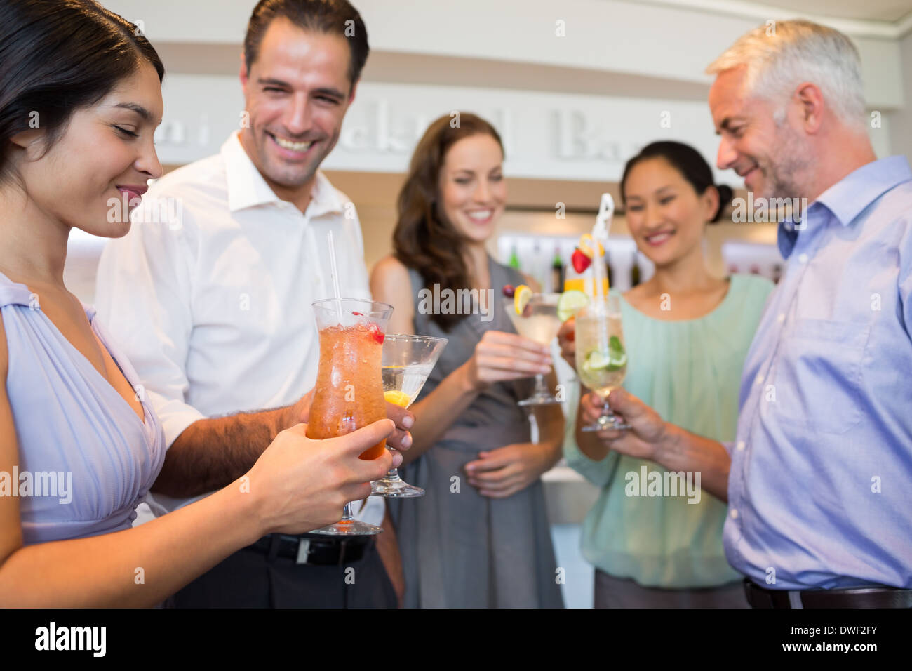 Hands toasting with cocktails hi-res stock photography and images - Alamy