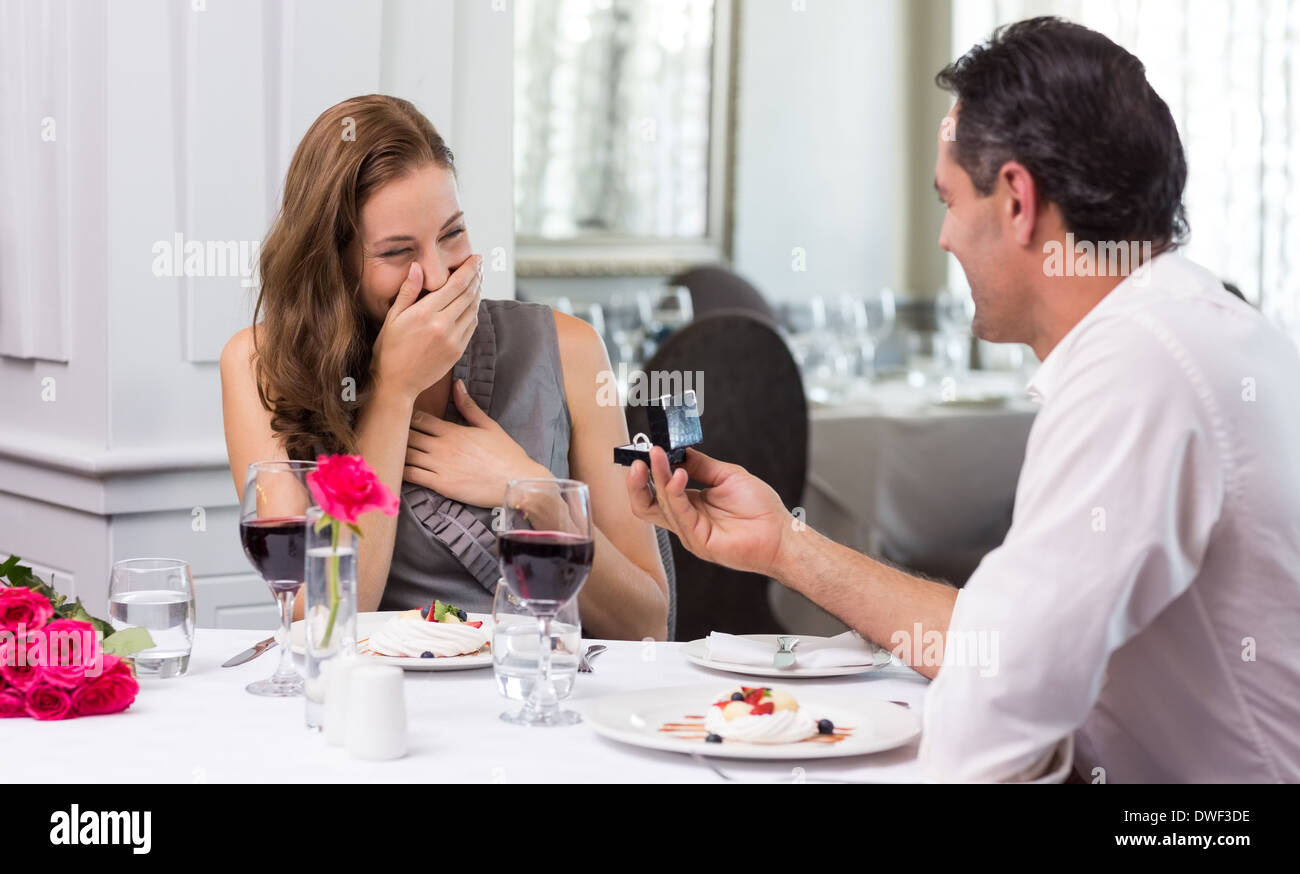 Man proposing a surprised woman in the restaurant Stock Photo - Alamy