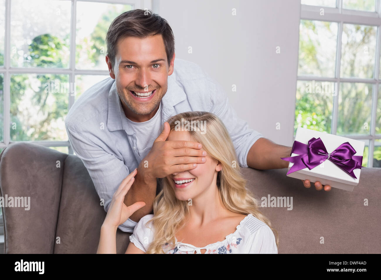 Young man surprising gift hi-res stock photography and images - Alamy