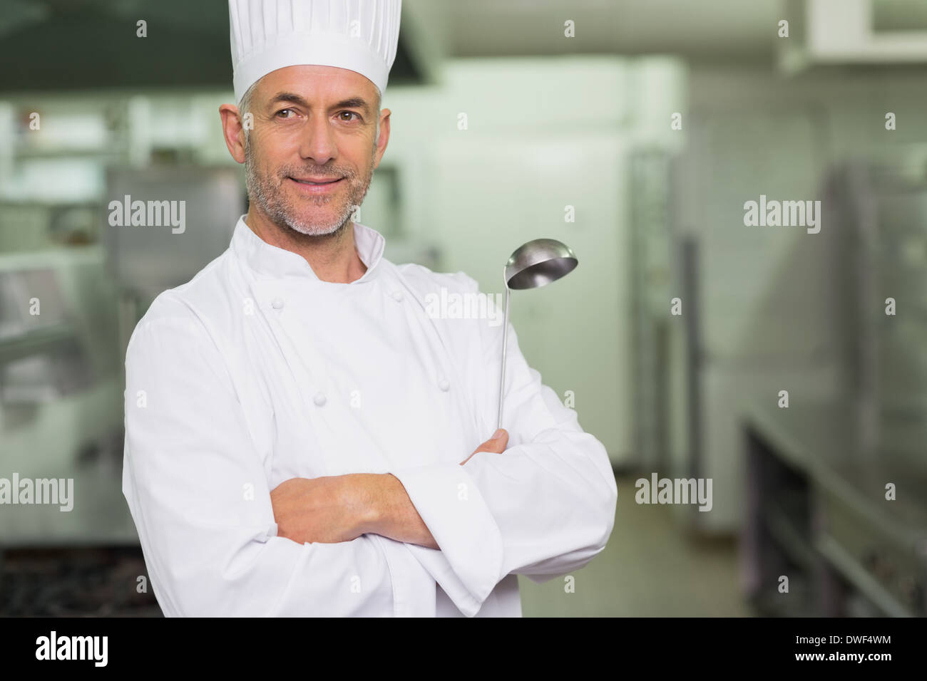 Chef holding ladle smiling hi-res stock photography and images - Alamy
