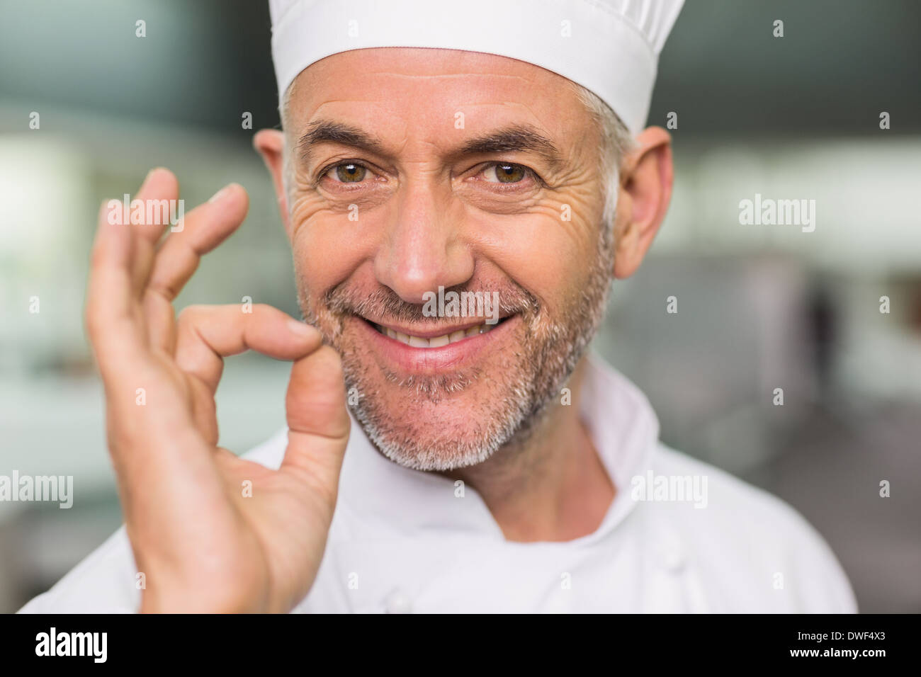 Happy chef looking at the camera making ok sign Stock Photo - Alamy