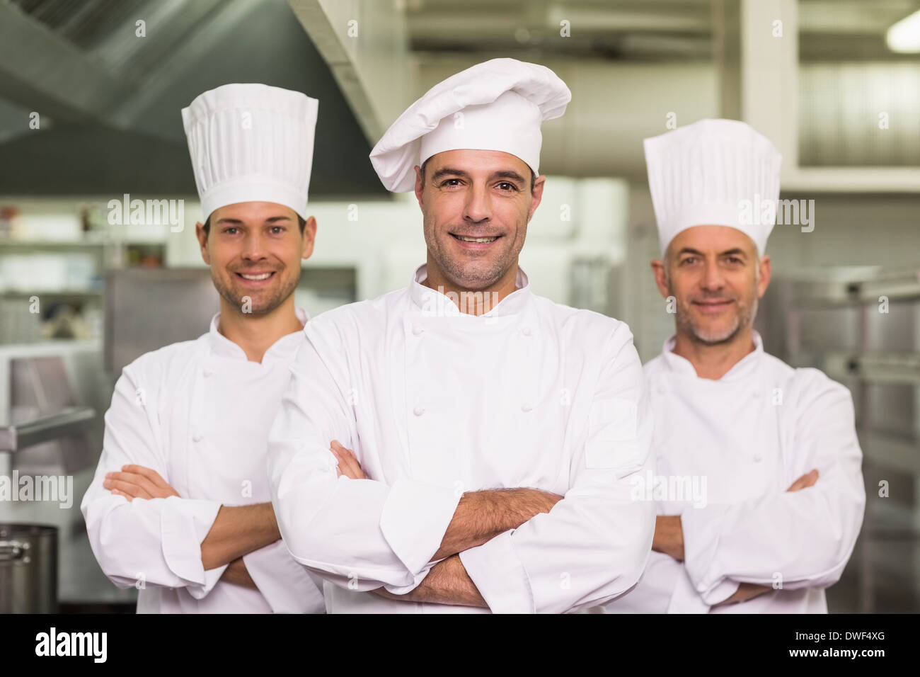 Happy team chefs looking camera hi-res stock photography and images - Alamy