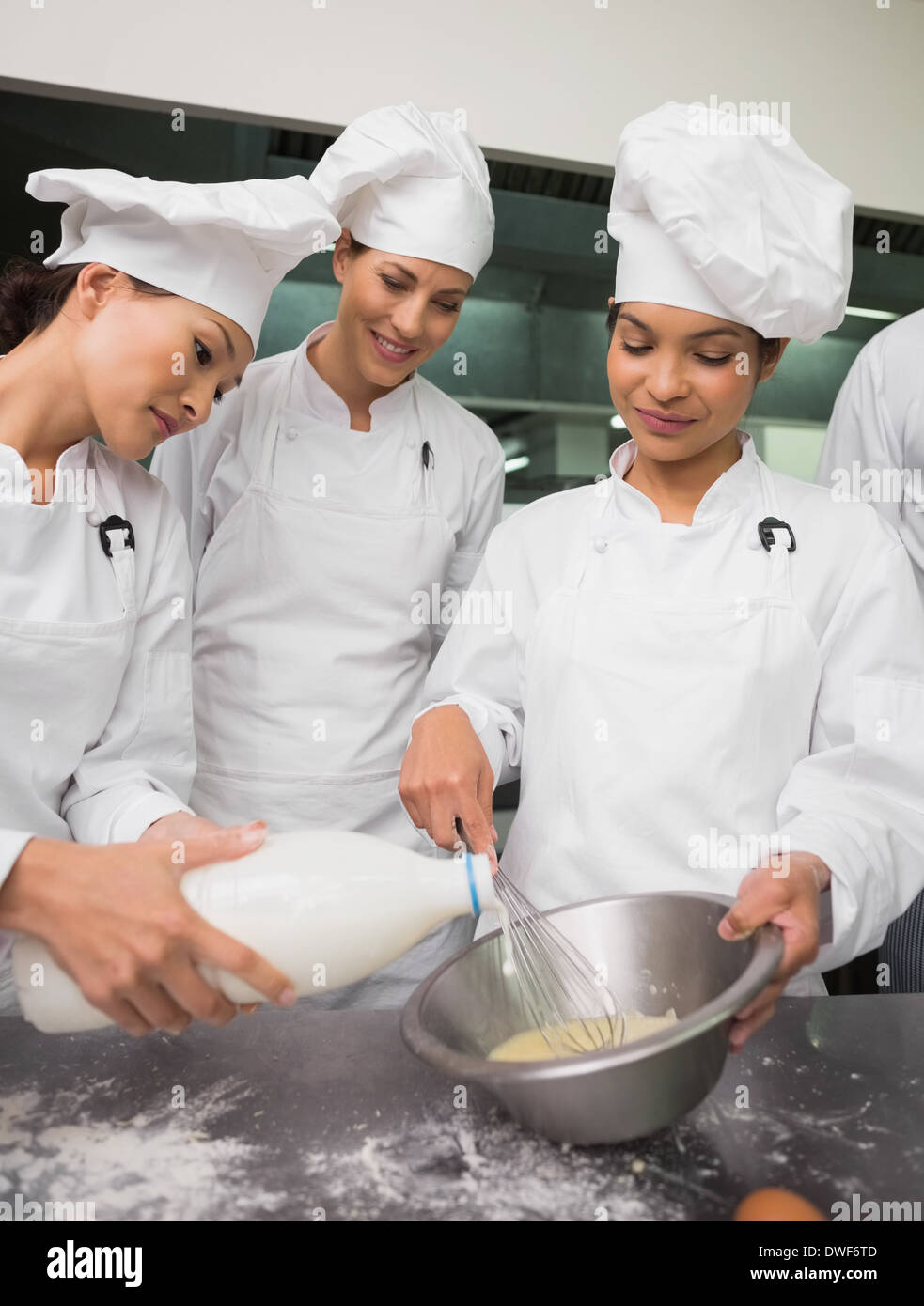 Chefs preparing pastry together Stock Photo - Alamy