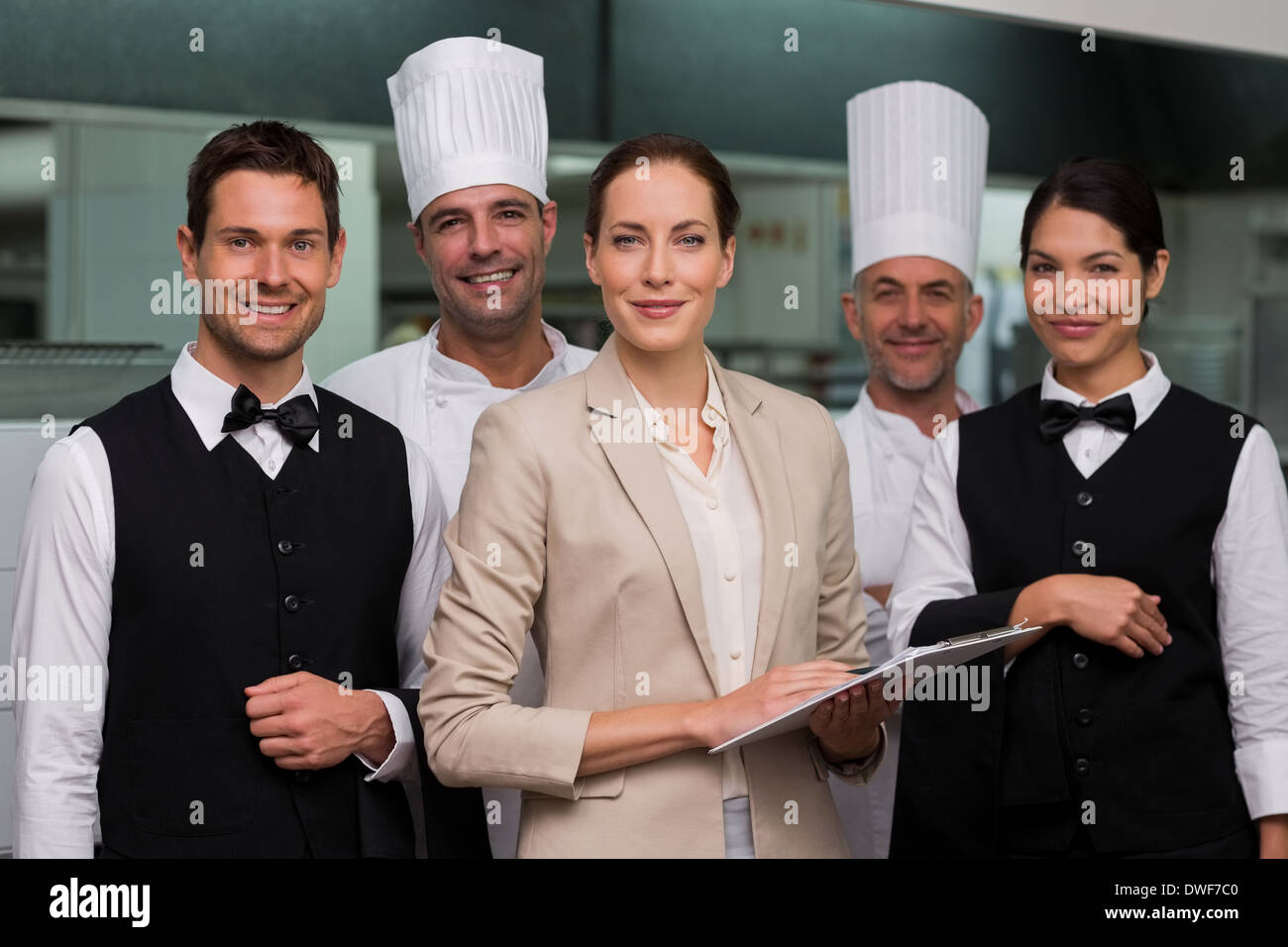 Restaurant team posing together smiling at camera Stock Photo - Alamy