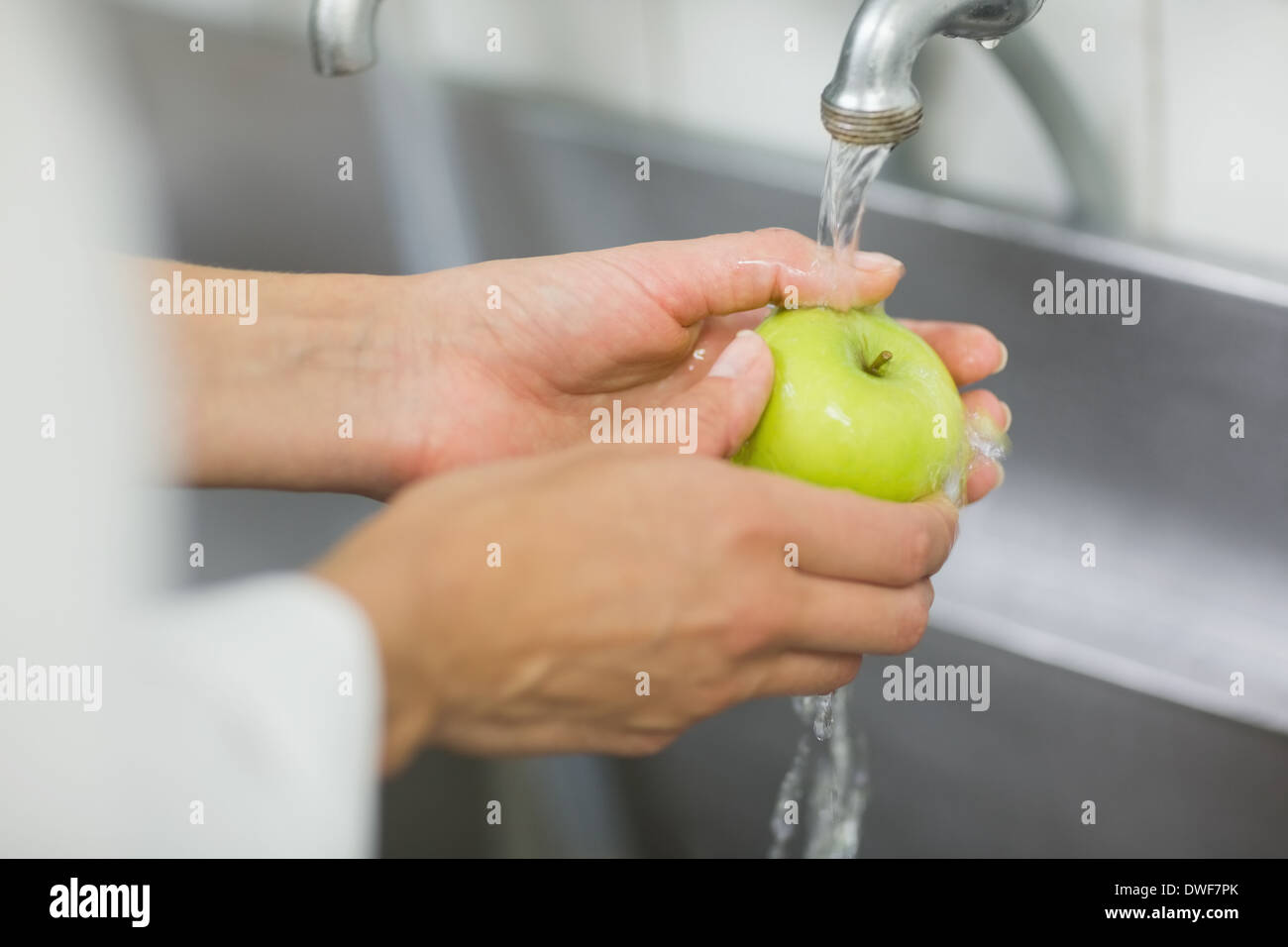 Woman washing apple hi-res stock photography and images - Alamy