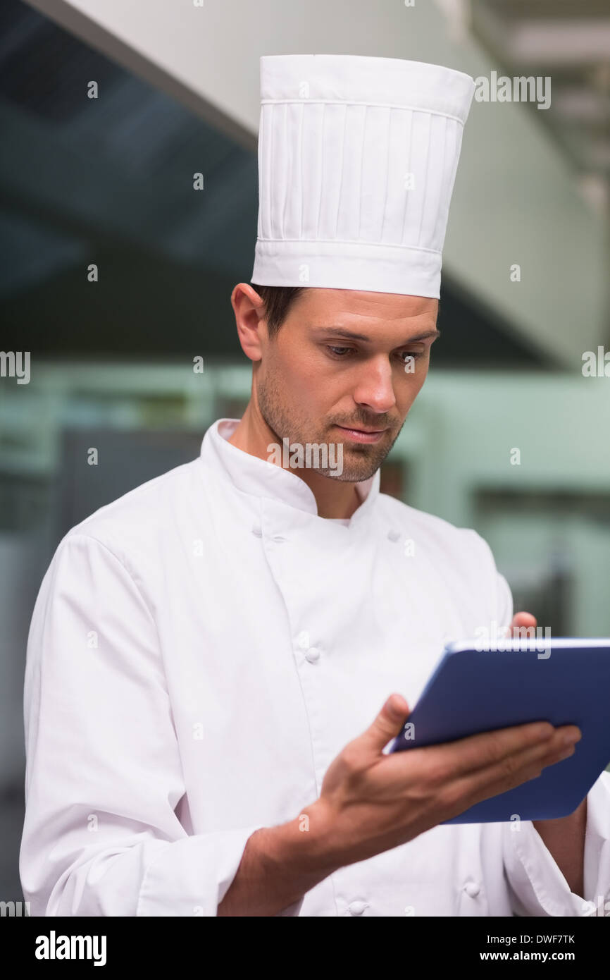 Chef using tablet pc Stock Photo - Alamy