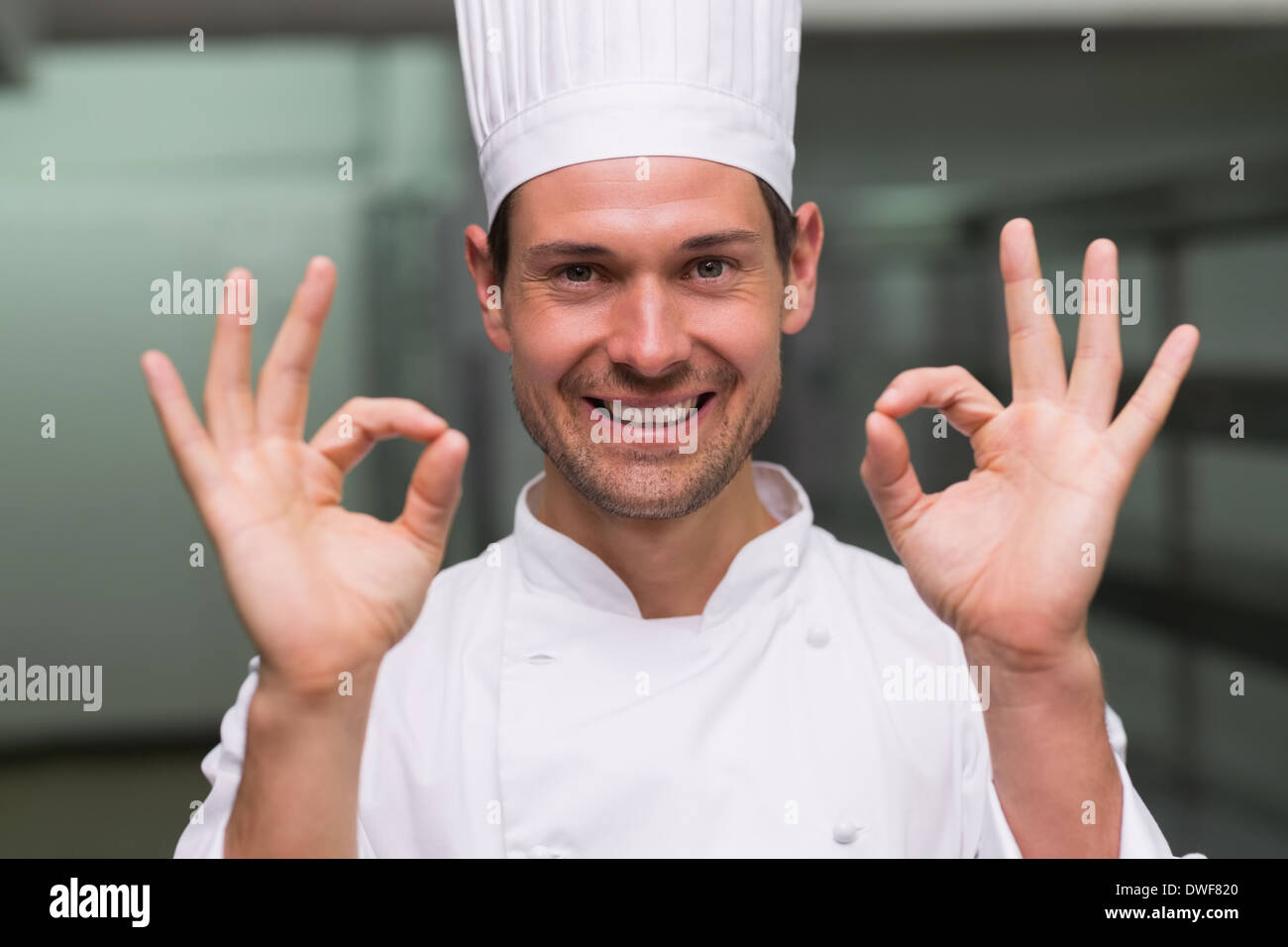 Happy chef making ok sign to camera Stock Photo - Alamy