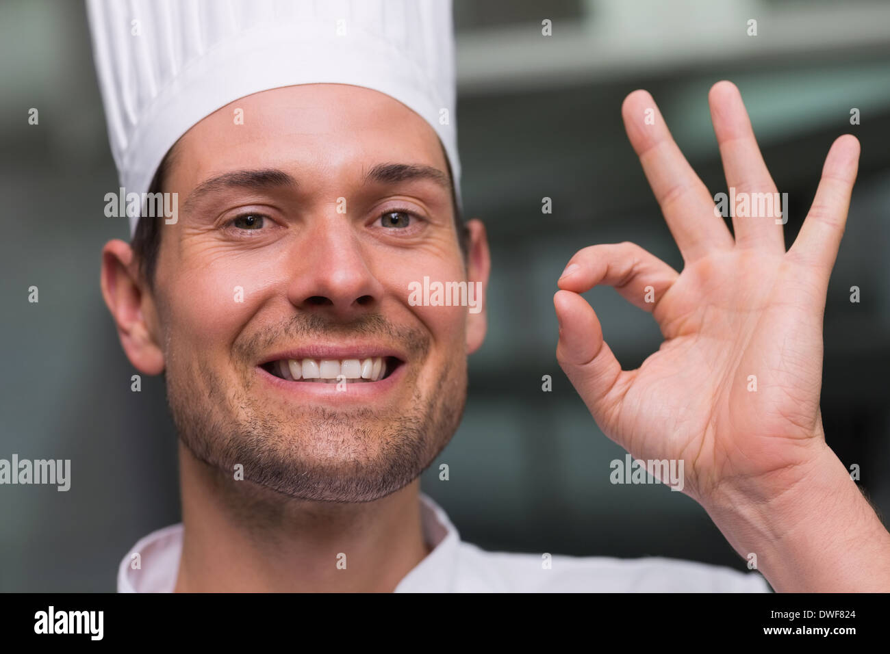 Happy chef making ok sign to camera Stock Photo - Alamy