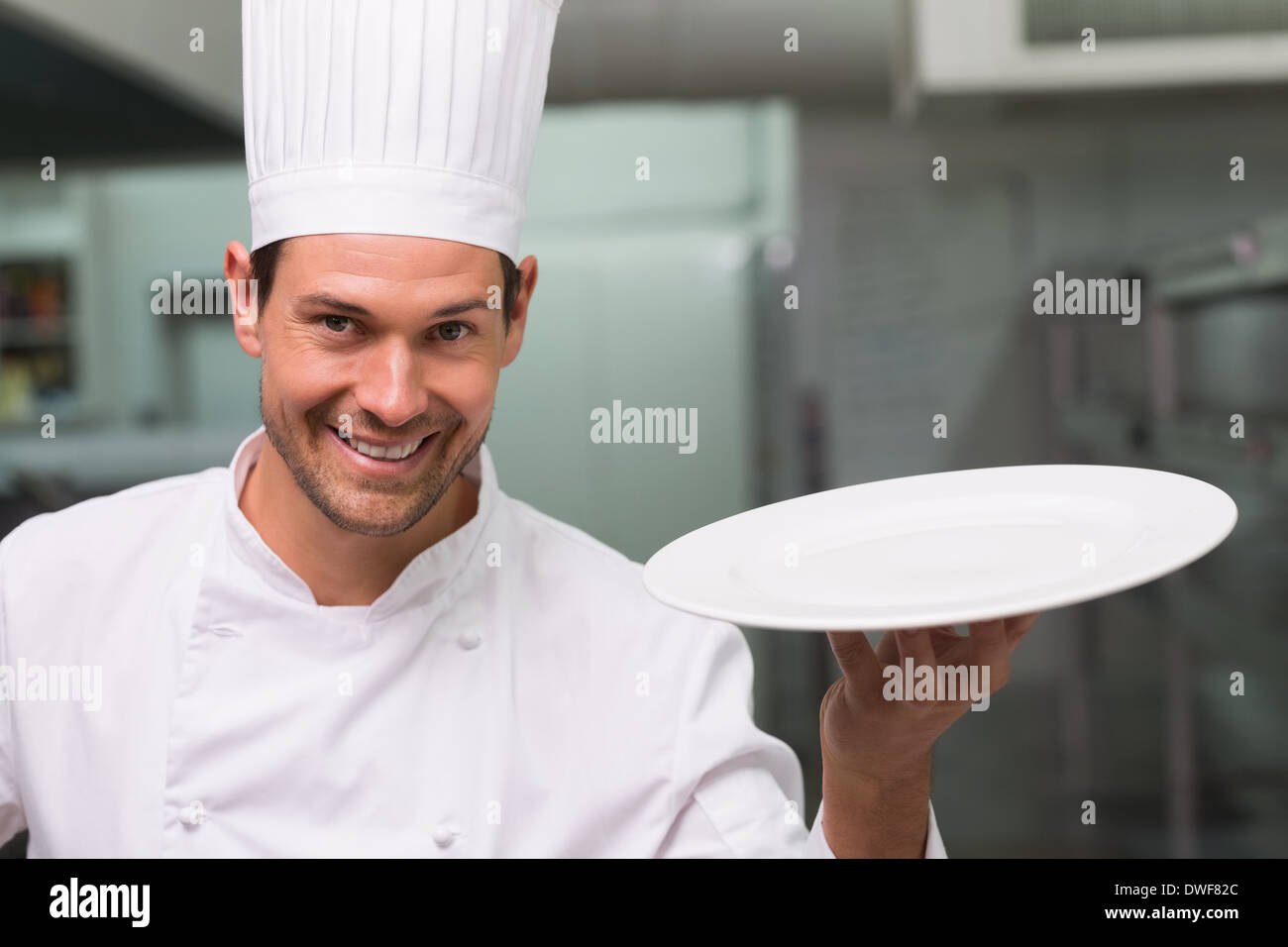 Chef holding plate smiling hi-res stock photography and images - Alamy