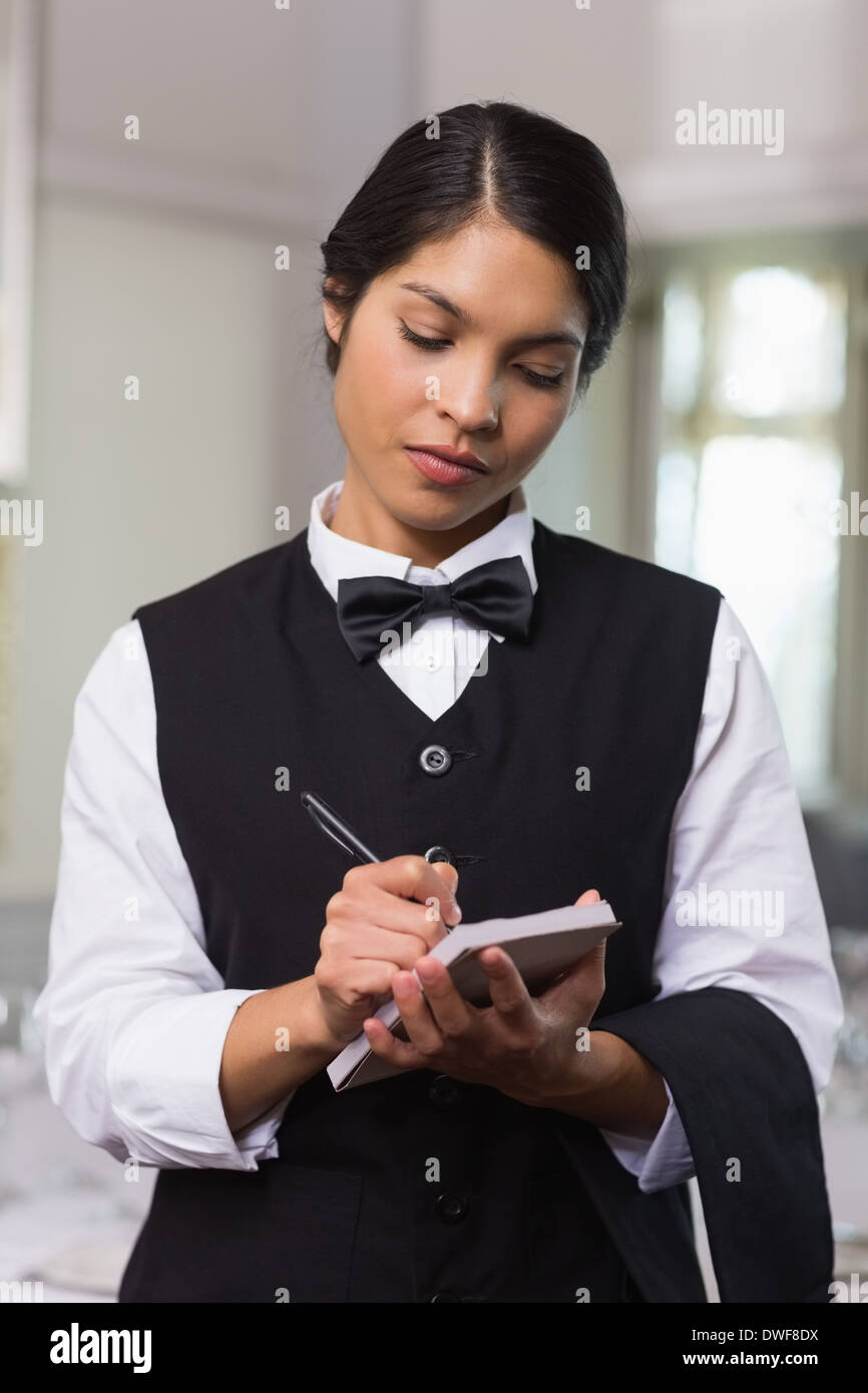 Pretty waitress taking an order Stock Photo - Alamy