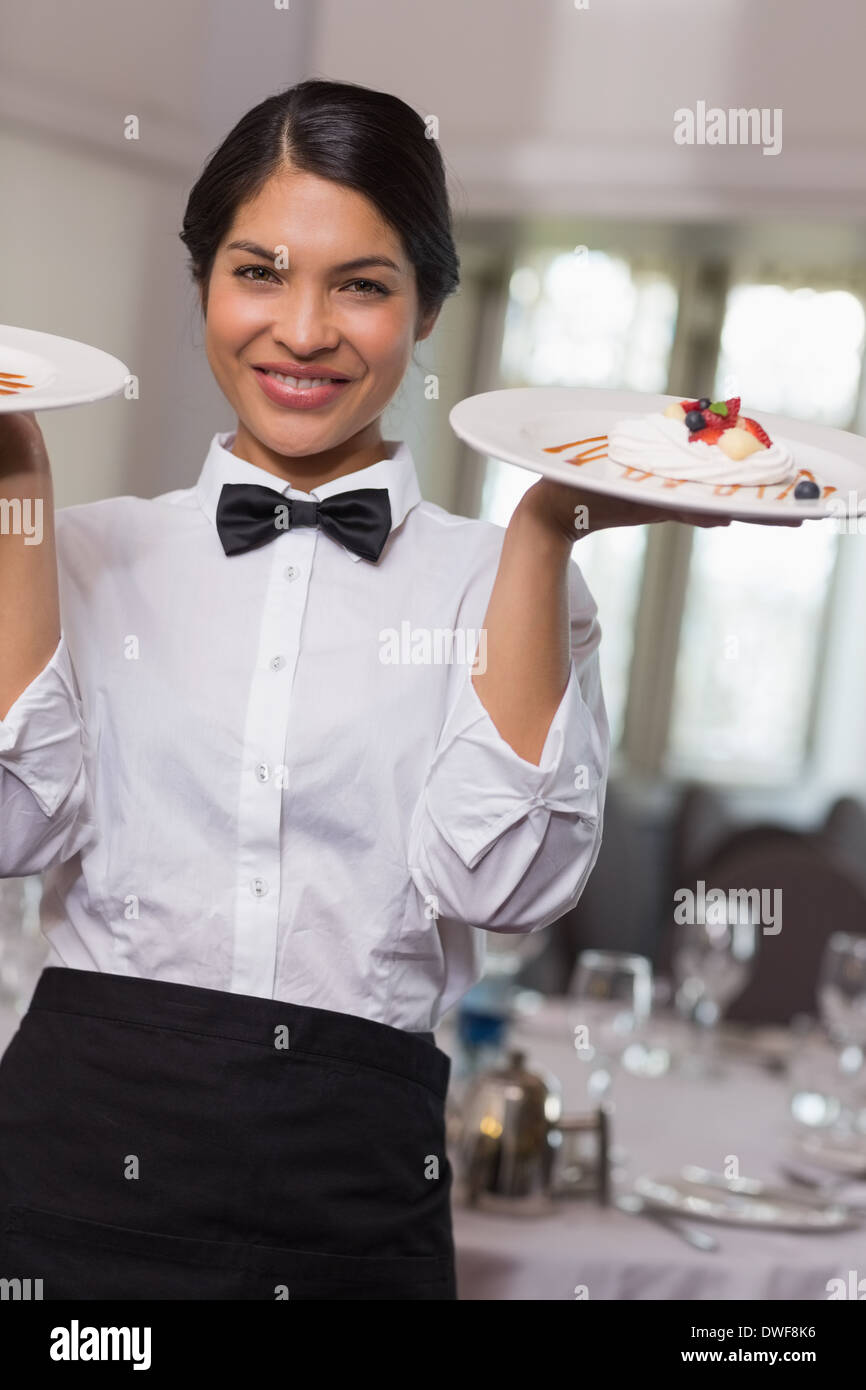 Waitress with plates hi-res stock photography and images - Alamy