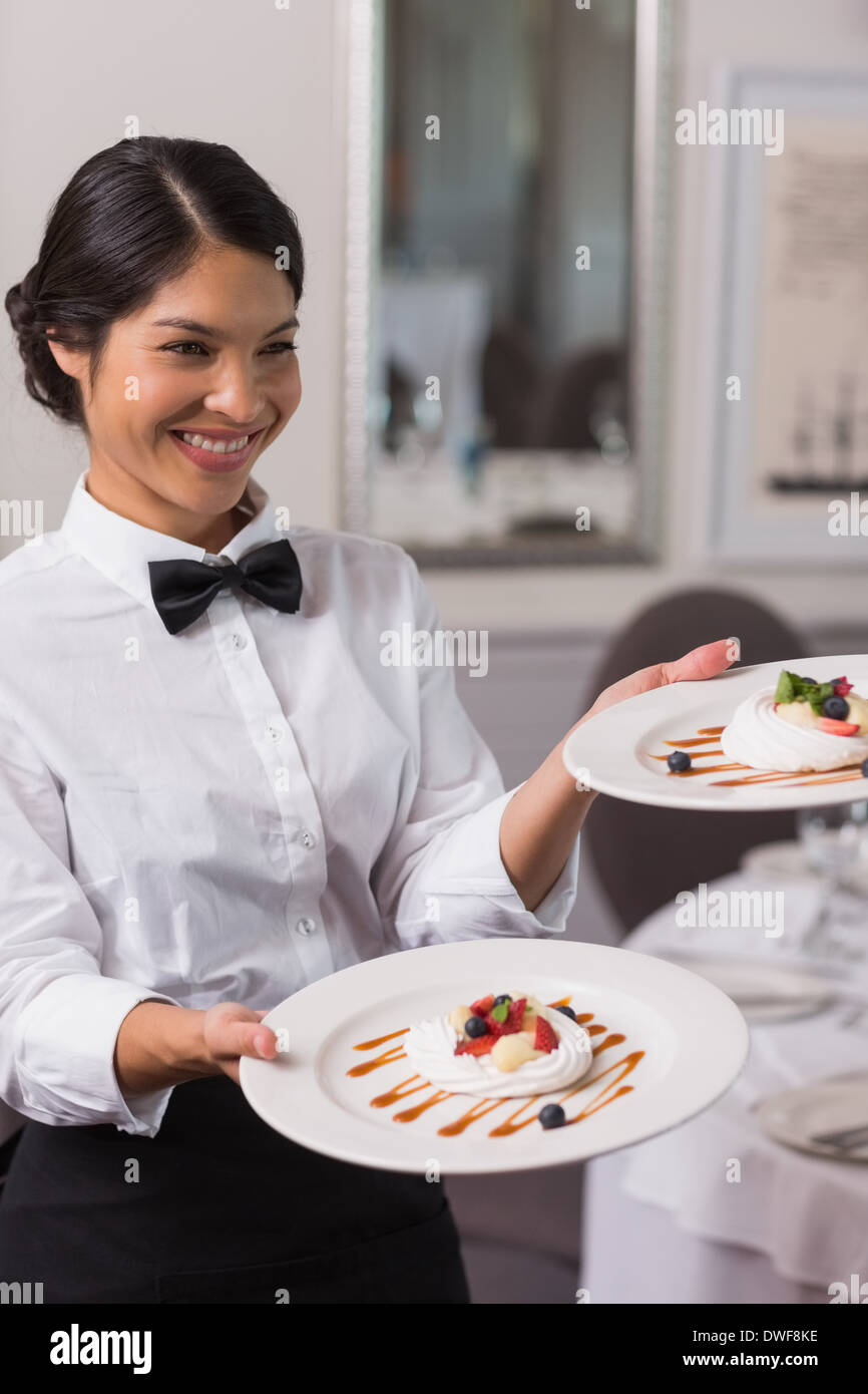 Waitress with plates hi-res stock photography and images - Alamy
