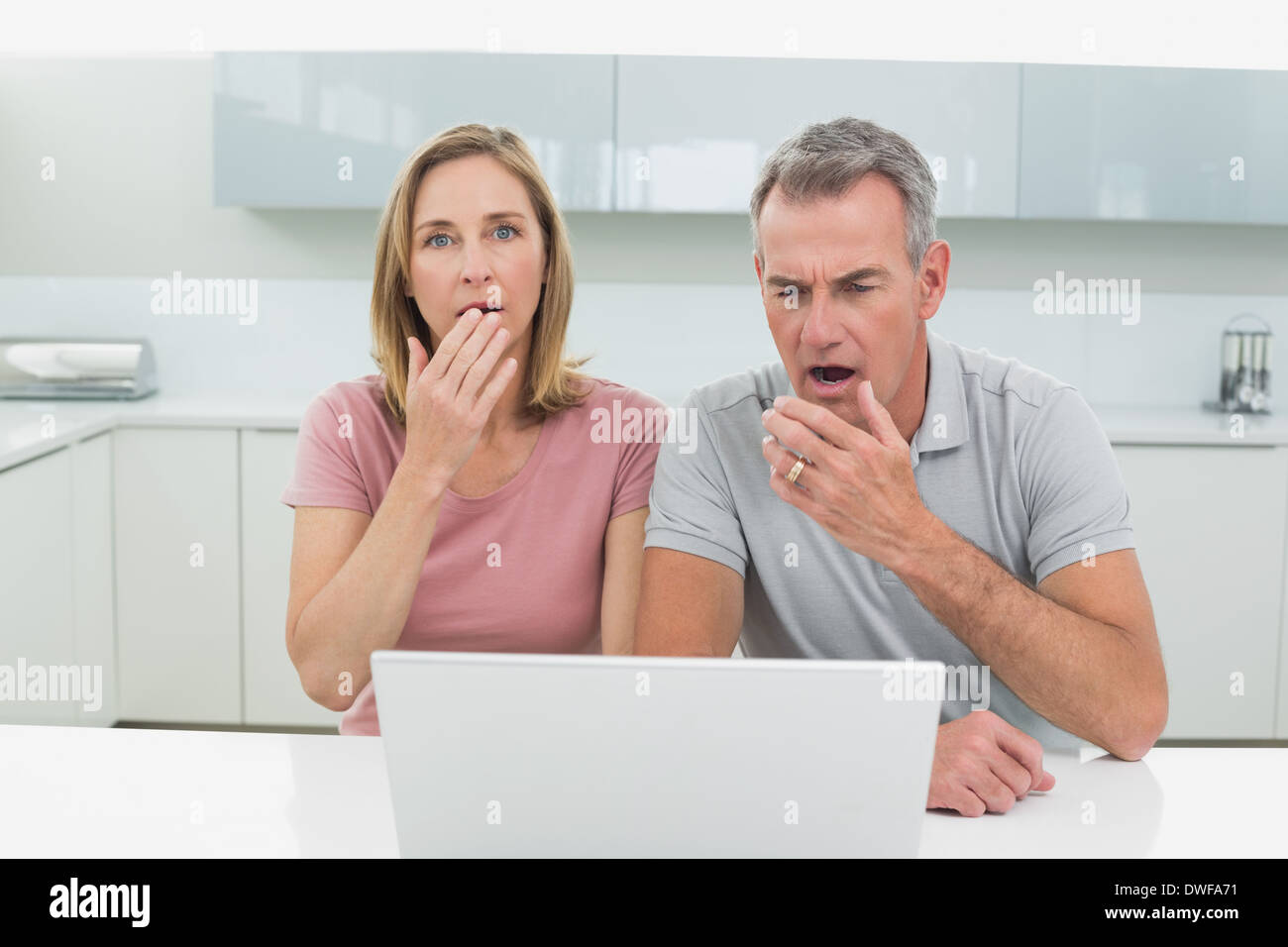 Shocked mature woman using hi-res stock photography and images - Alamy