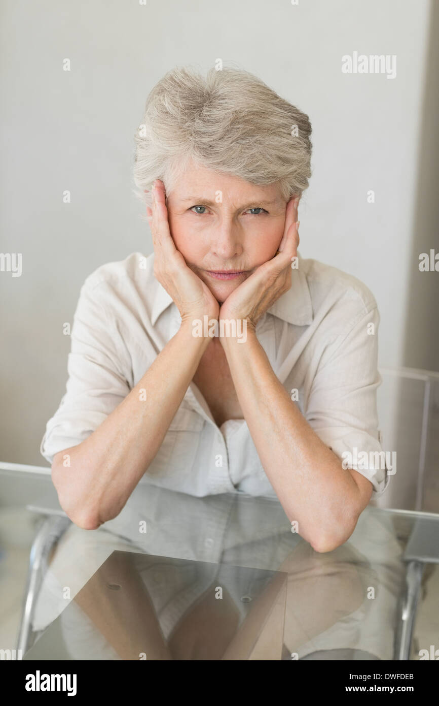 Woman head hands sad table hi-res stock photography and images - Alamy