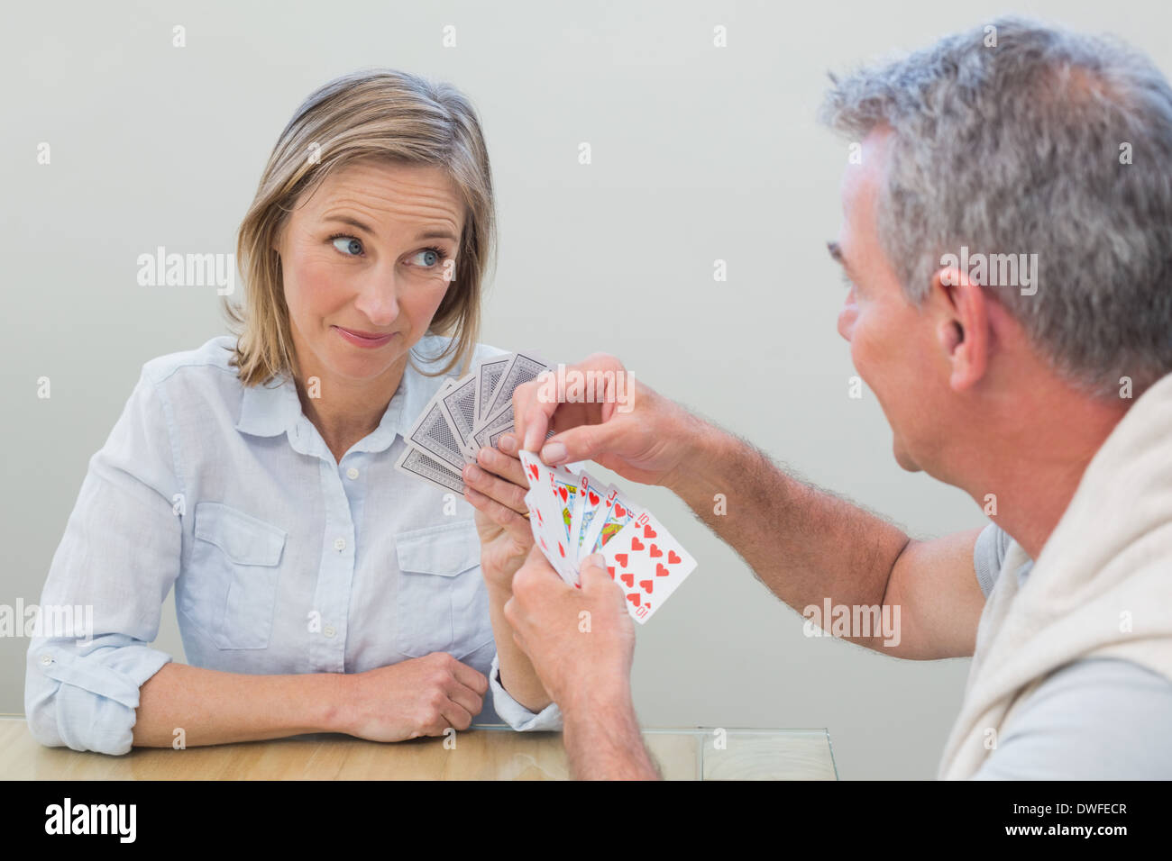 Couple playing cards at home Stock Photo - Alamy