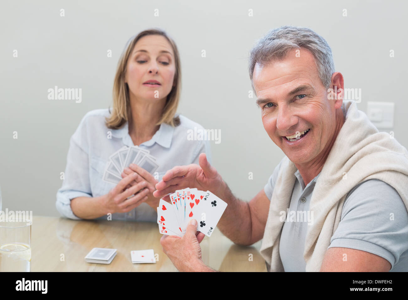 Couple playing cards at home Stock Photo - Alamy