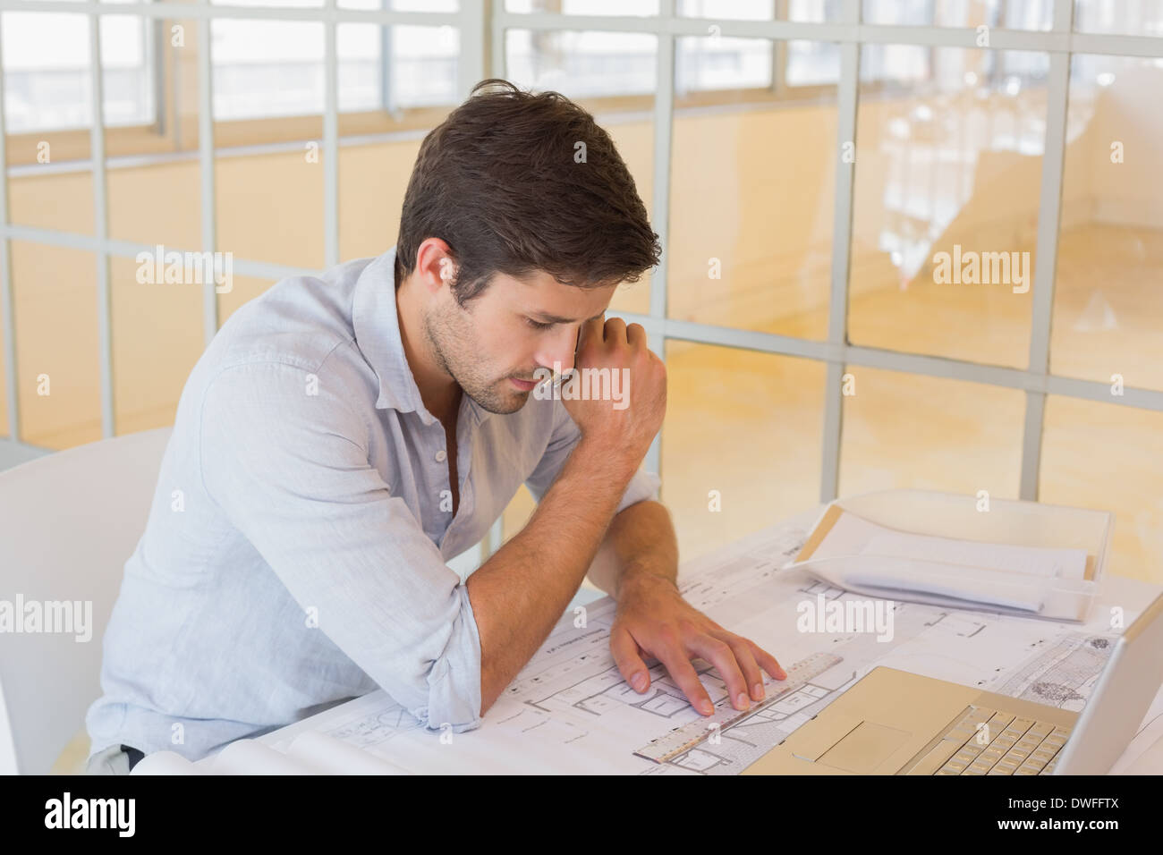 Businessman with blueprints hi-res stock photography and images - Alamy