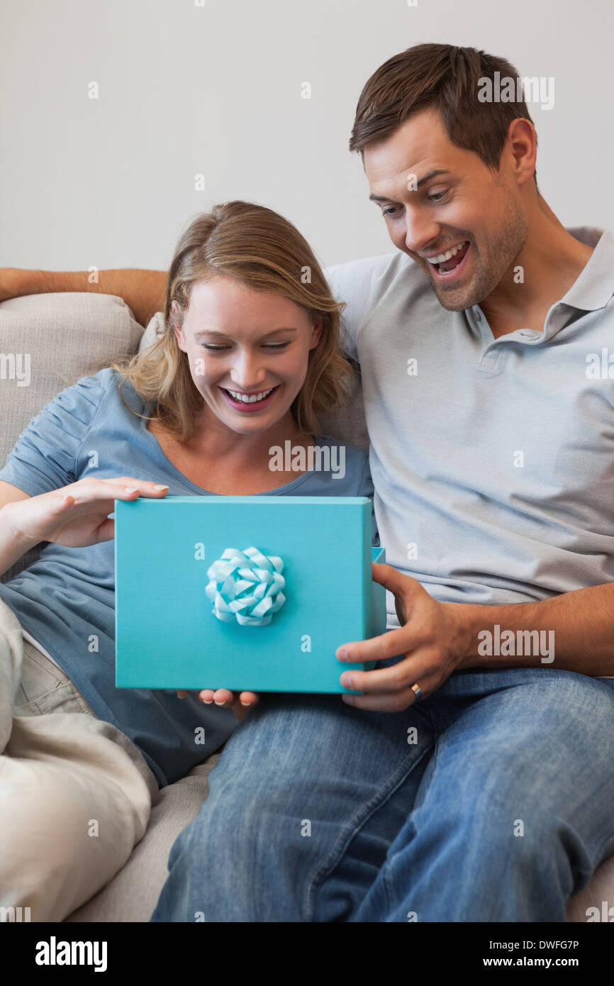 Happy woman receiving gift hi-res stock photography and images - Alamy