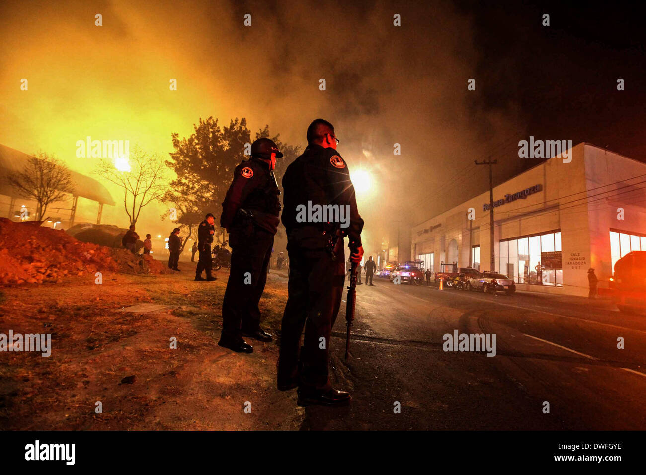Mexico City, Mexico. 5th Mar, 2014. A car dealership caught fire in ...