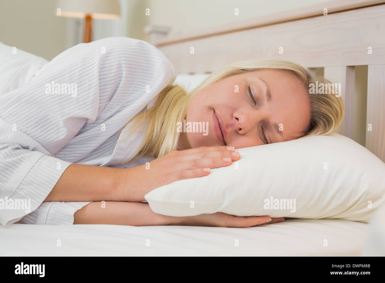 Woman sleeping in bed at home Stock Photo - Alamy