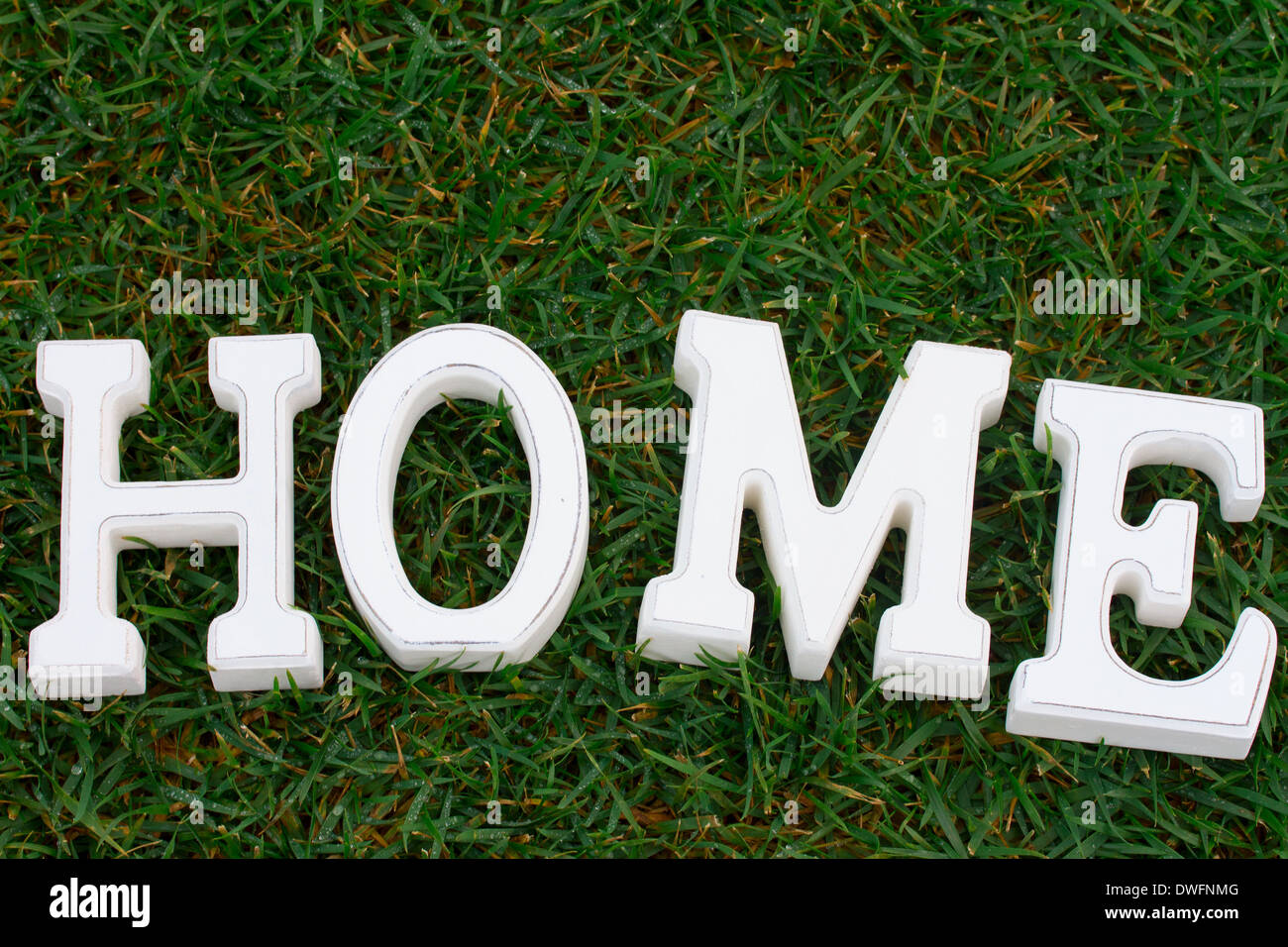 White Home sign on grass Stock Photo - Alamy