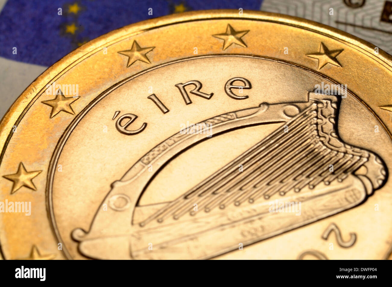 Irish 1 Euro coin on €5 note Stock Photo - Alamy