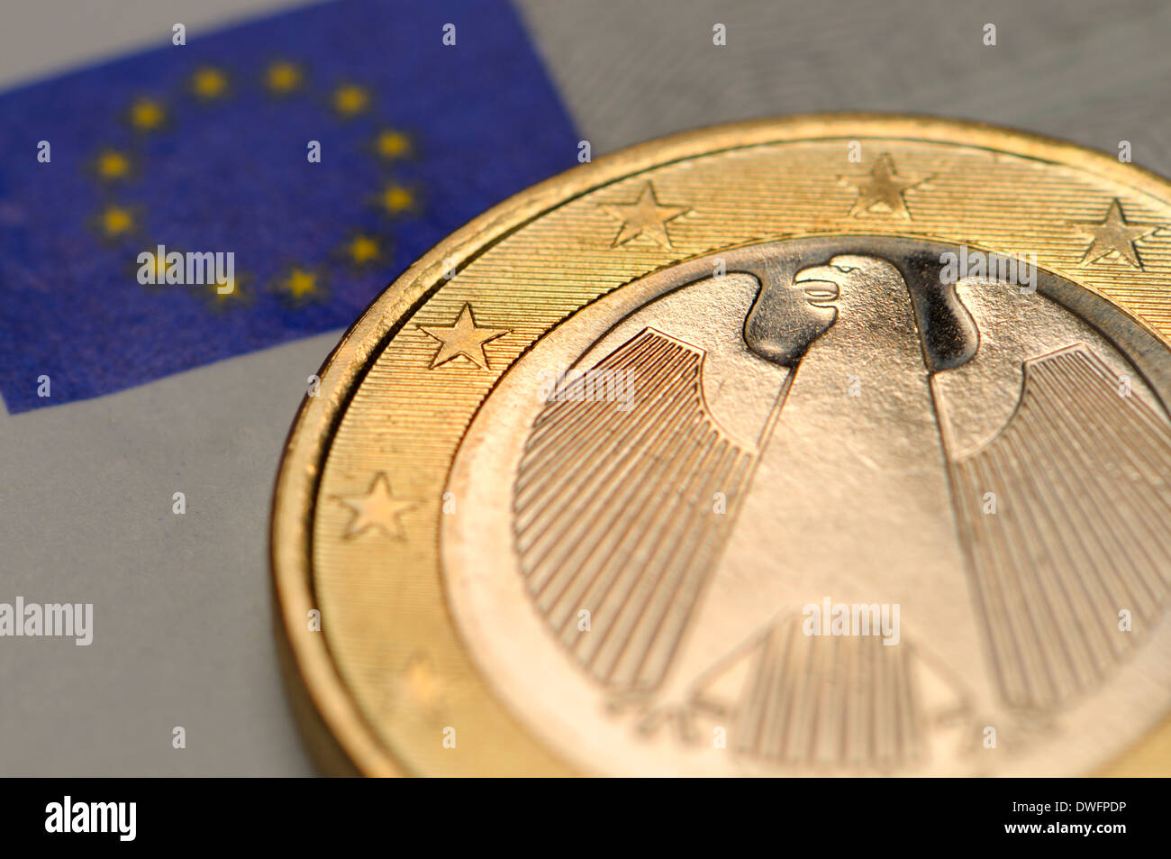 German 1 Euro coin on €5 Euro note Stock Photo - Alamy