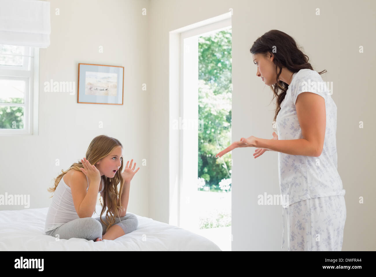 Mother and daughter arguing in bedroom Stock Photo - Alamy