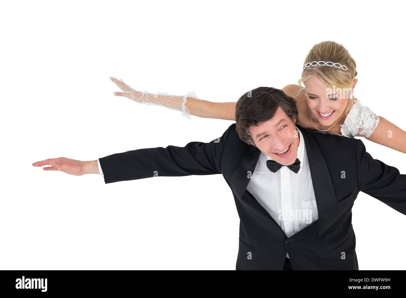 Playful newly wed couple with arms outstretched Stock Photo - Alamy