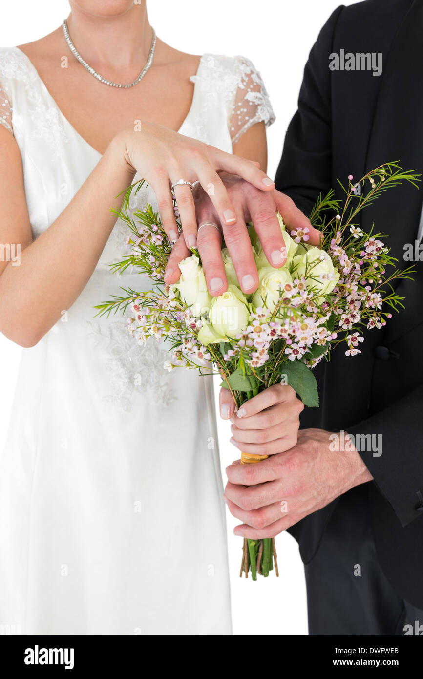 Bride and groom showing wedding ring Stock Photo - Alamy