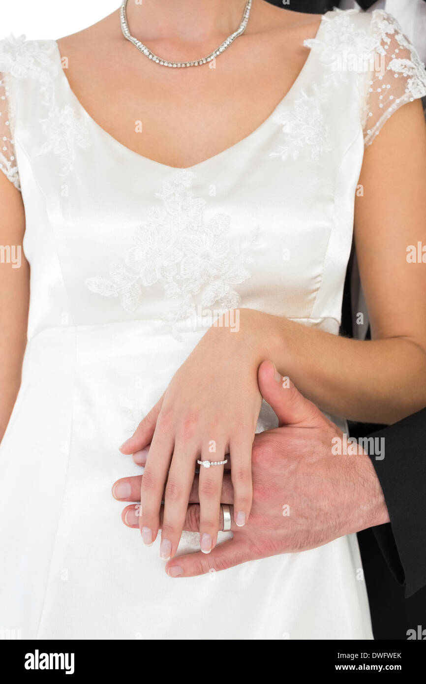 Newly married couple showing wedding rings Stock Photo - Alamy