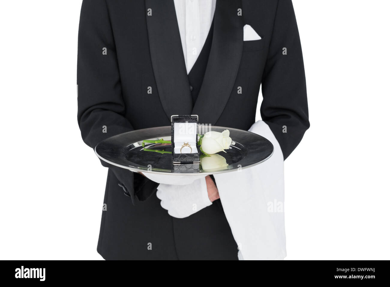 Mid section of server presenting engagement ring and rose Stock Photo ...