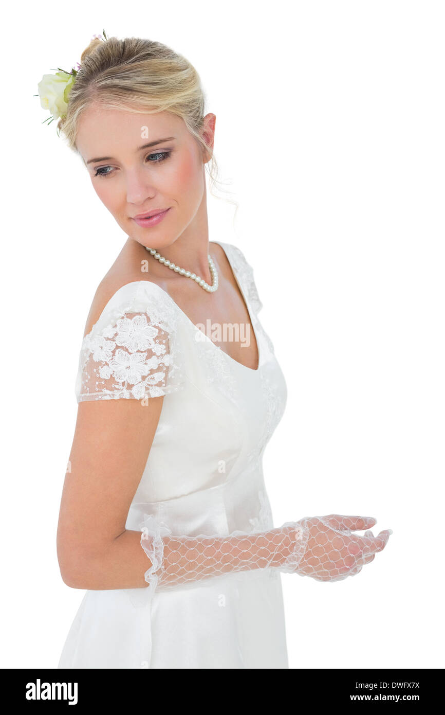 Bride looking over shoulder against white background Stock Photo - Alamy
