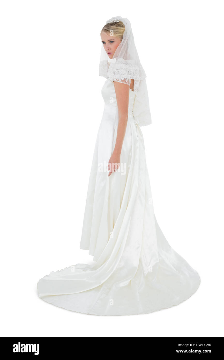 Full length of thoughtful bride in wedding dress Stock Photo - Alamy