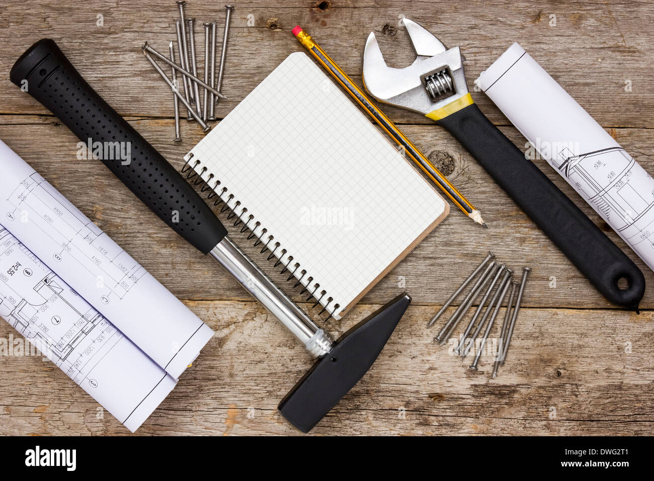 Tools , twisted technical drawing and blank notebook Stock Photo - Alamy
