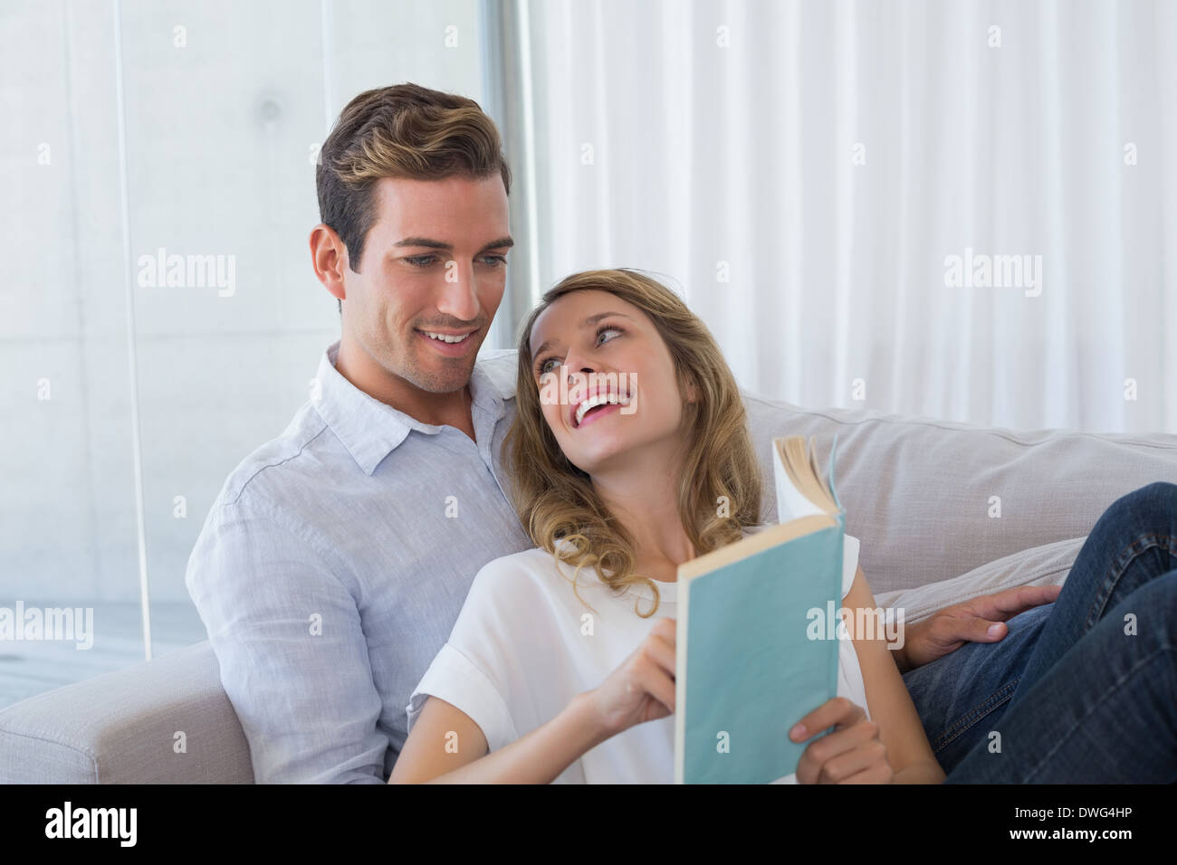 Romantic couple reading book on hi-res stock photography and images - Alamy
